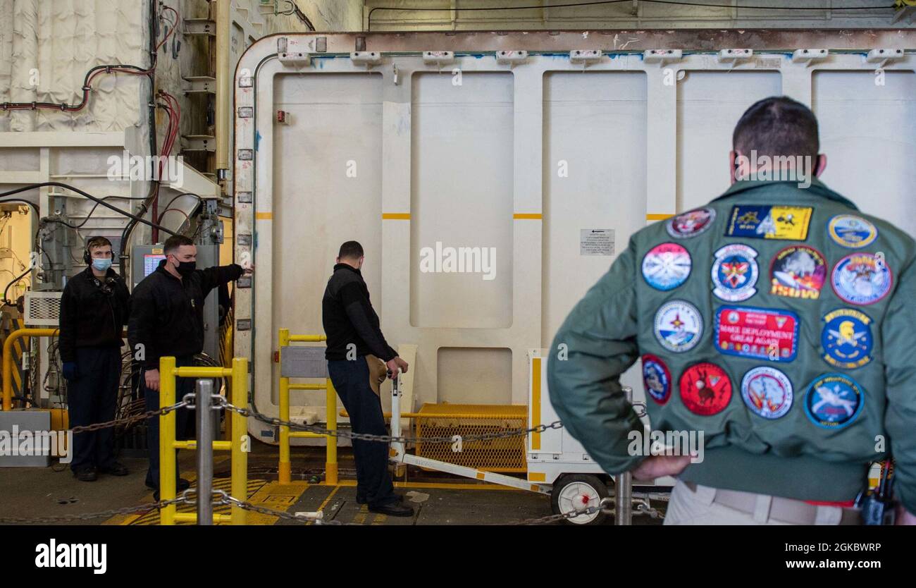 Sailors assigned to USS Gerald R. Ford (CVN 78) load equipment onto an ...