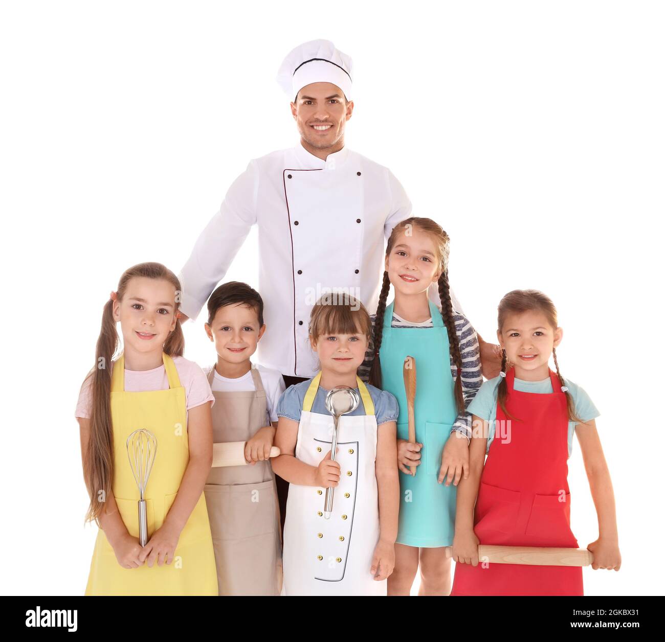Cute children with kitchen utensils and chef on white background ...