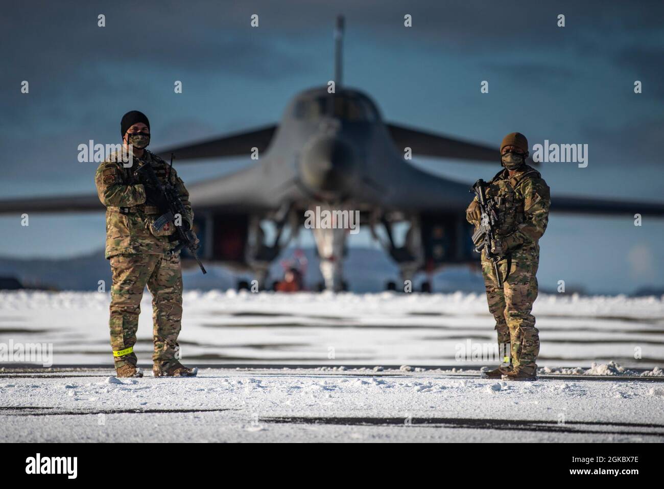 Two defenders assigned to the 7th Security Forces Squadron guard a B-1B ...