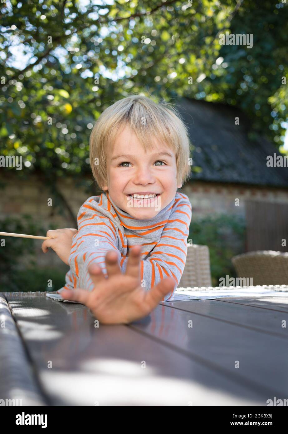 Portrait of cute positive friendly laughing boy 5 years old outdoors ...