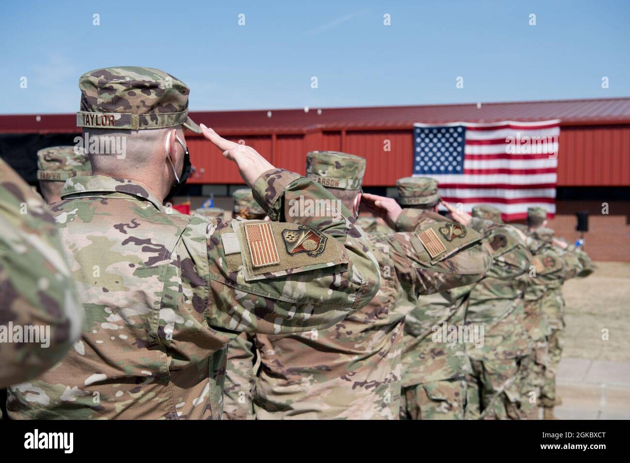 Members of the 138th Fighter Wing render a salute during a Purple Heart ...