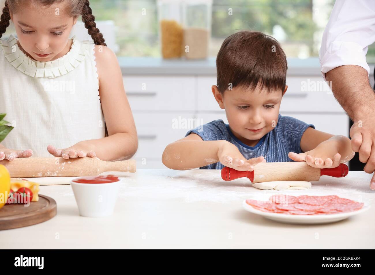 Cute children in kitchen during cooking classes Stock Photo - Alamy