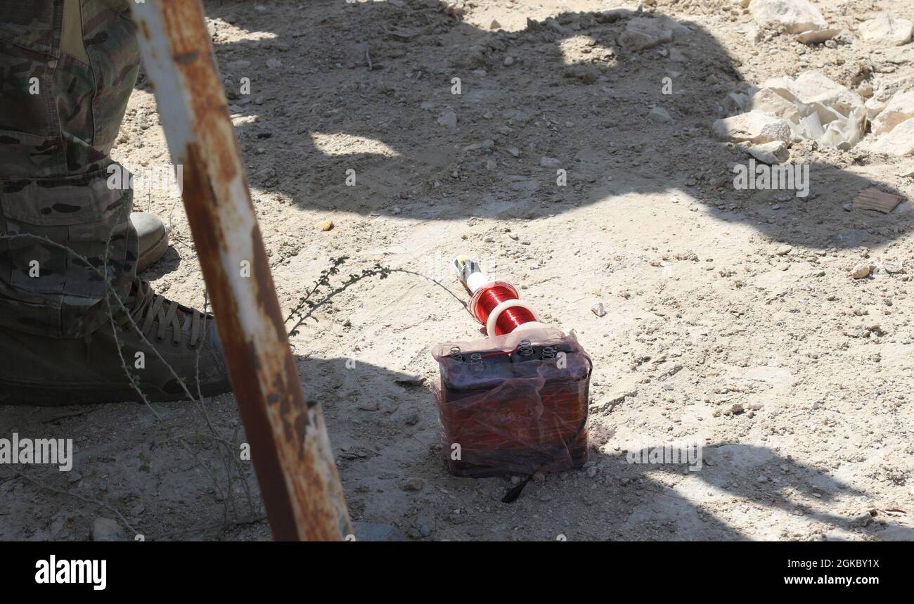 A U.S. Army Explosive Ordinance Disposal training instructor inspects a ...