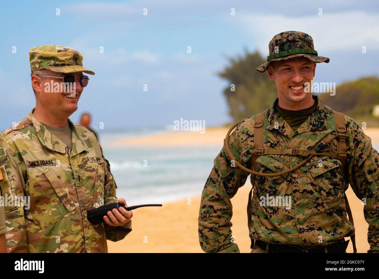 U.S. Army Chief Warrant Officer 3 Jason Milligan, left, a harbor master ...