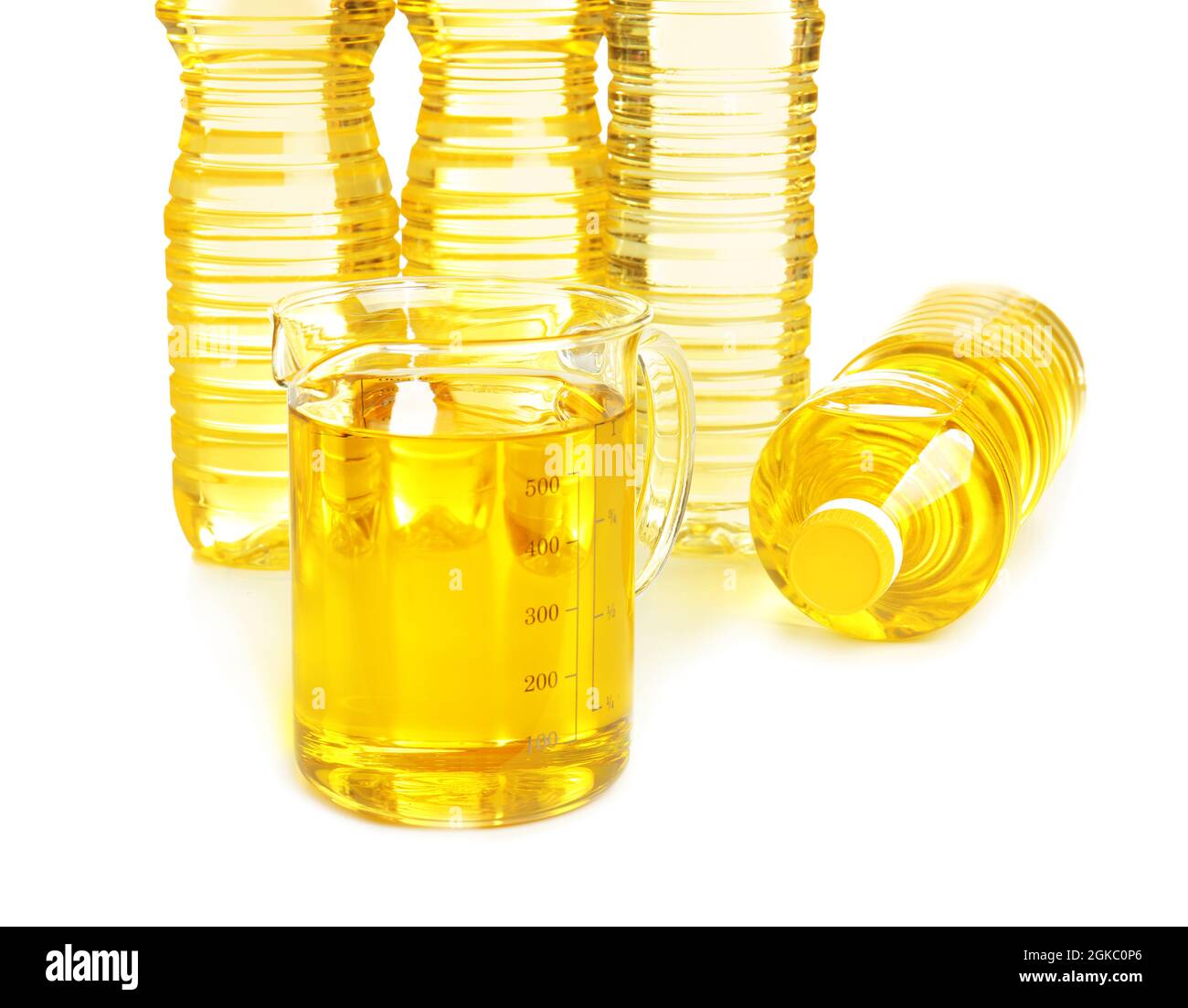 Beaker and bottles of cooking oil on white background Stock Photo - Alamy