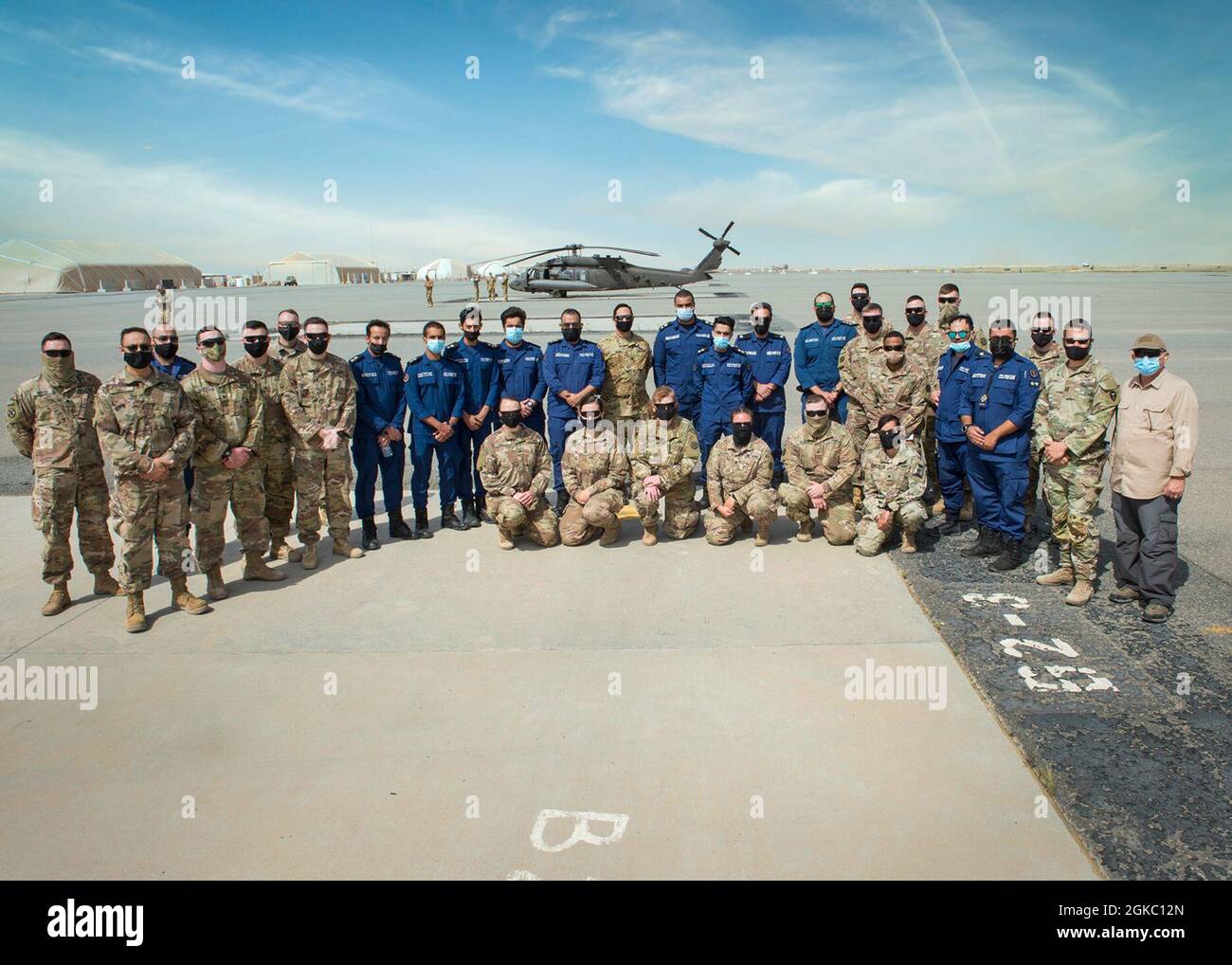 Members of the Kuwait Fire Force and U.S. Soldiers participate in a ...
