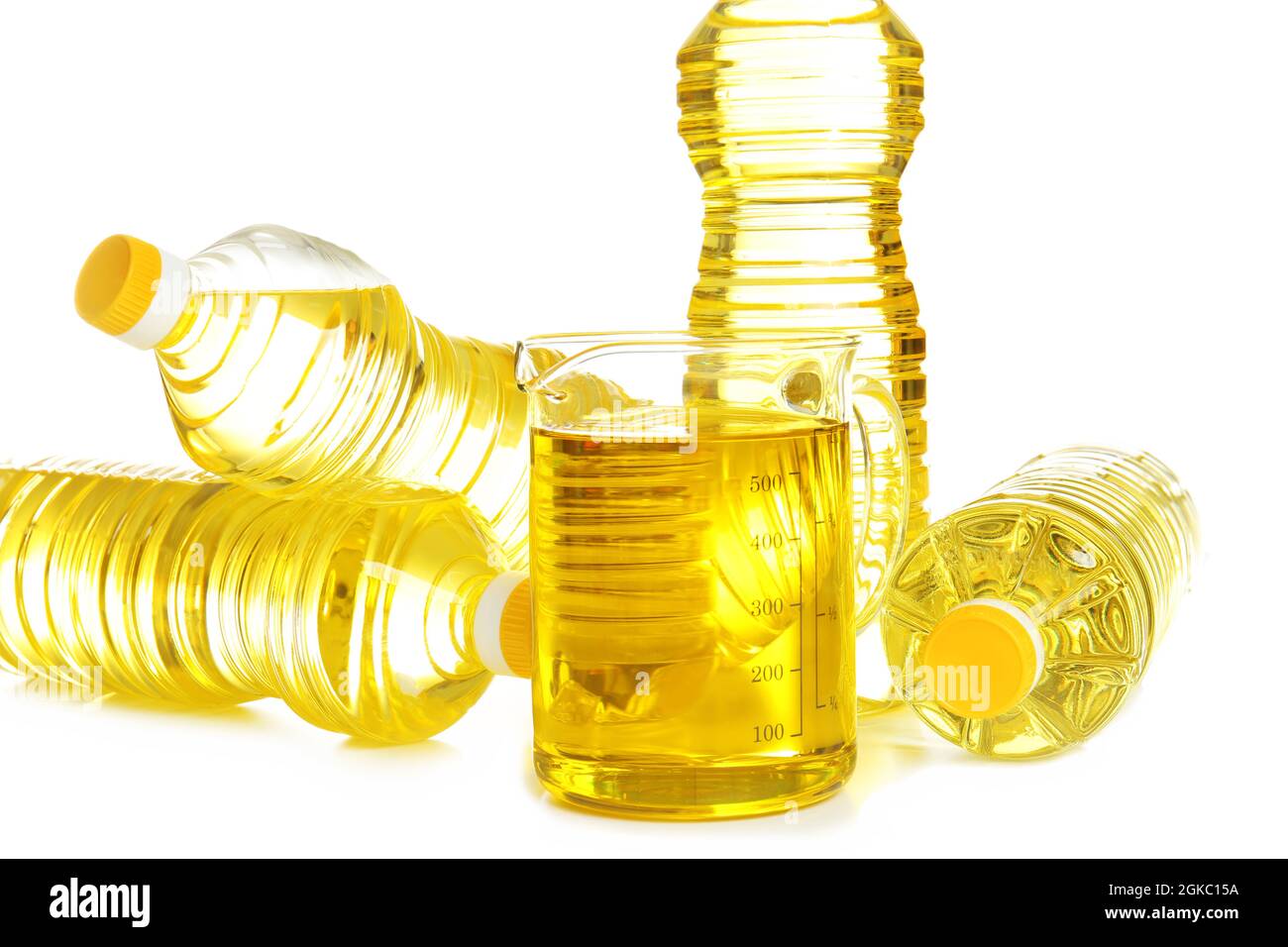 Beaker and bottles of cooking oil on white background Stock Photo - Alamy