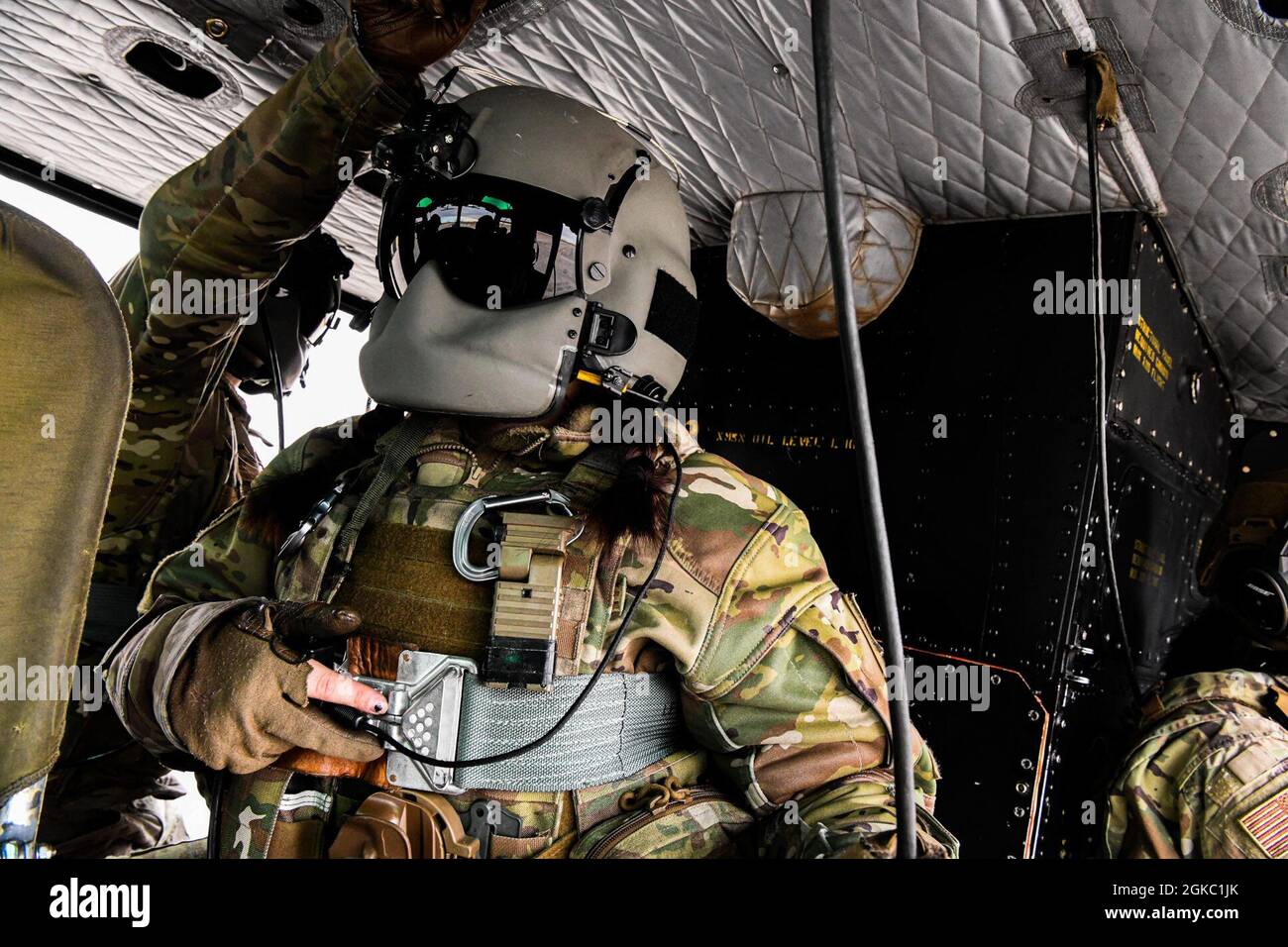Senior Airman Kayli Conrad, flight engineer and gunner, sits on an all ...
