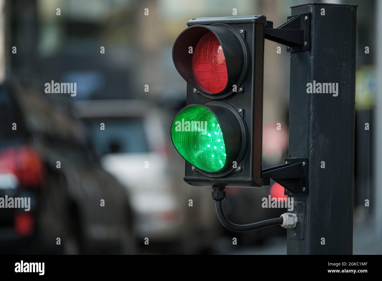 The green light is on at the two-color traffic light Stock Photo - Alamy