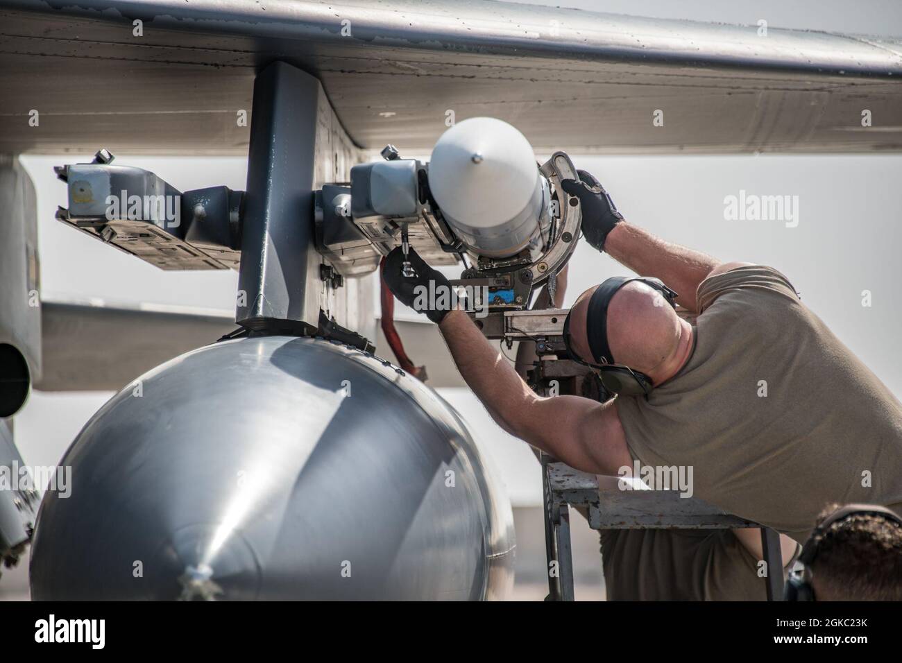U.S. Airmen with the 379th Expeditionary Maintenance Squadron munitions ...