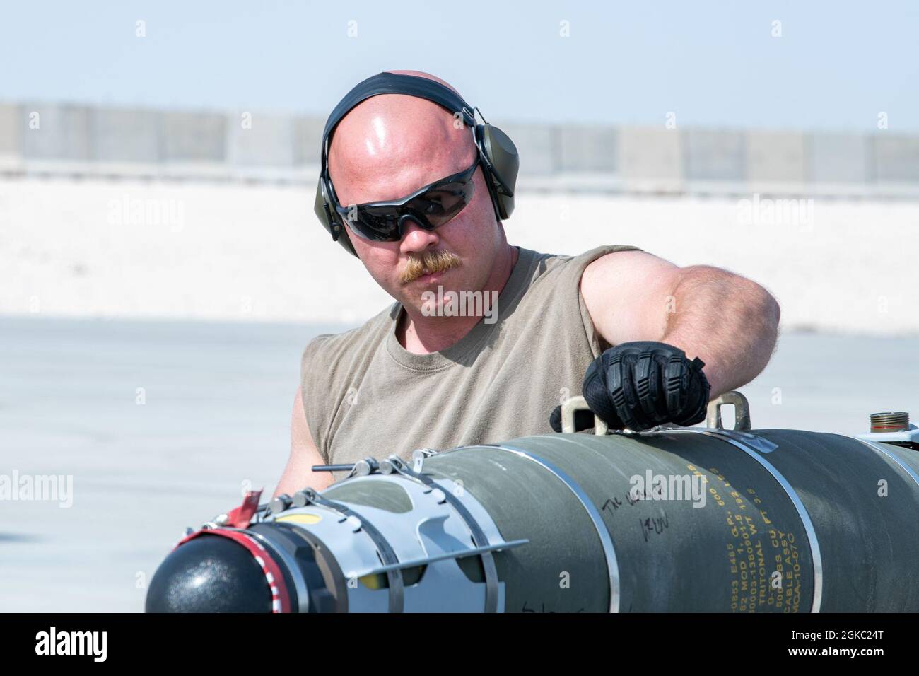 Airmen from the 379th Expeditionary Maintenance Squadron munitions ...