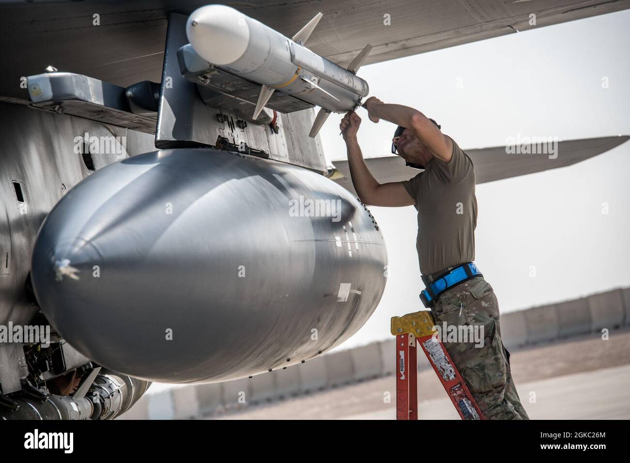 U.S. Airmen with the 379th Expeditionary Maintenance Squadron munitions ...