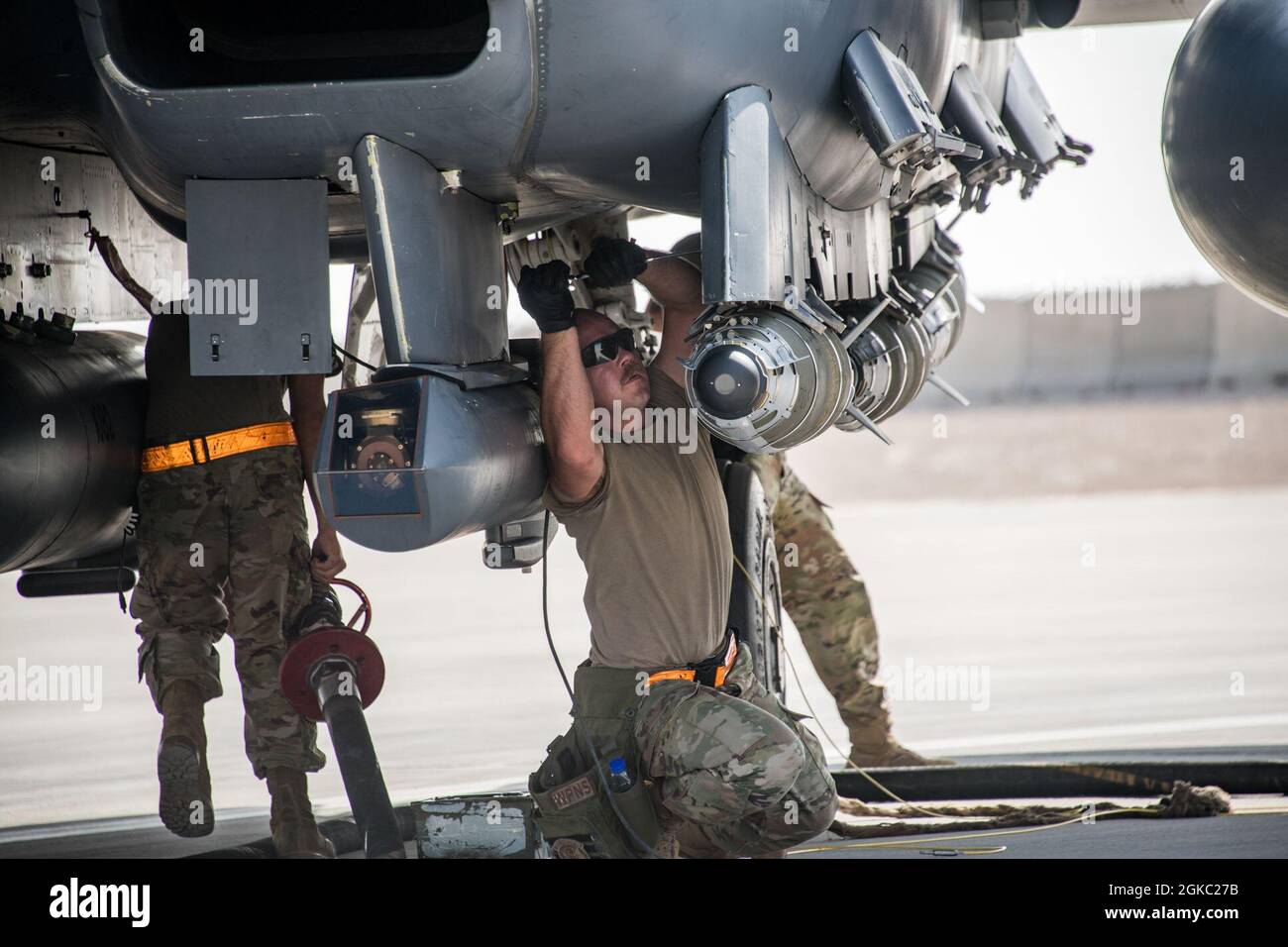 U.S. Airmen with the 379th Expeditionary Maintenance Squadron munitions ...