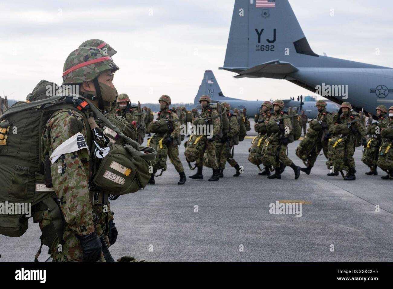 Japan Ground Self Defense Force paratroopers line up to load onto a C ...