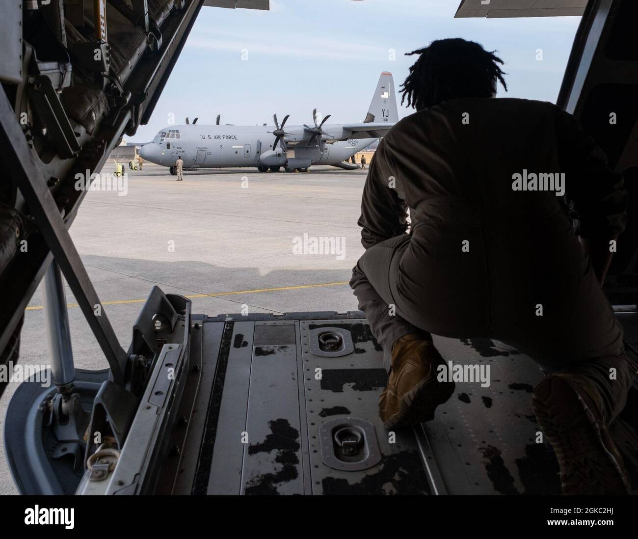 Staff Sgt. Toiannah Campbell, 36th Airlift Squadron loadmaster, watches ...