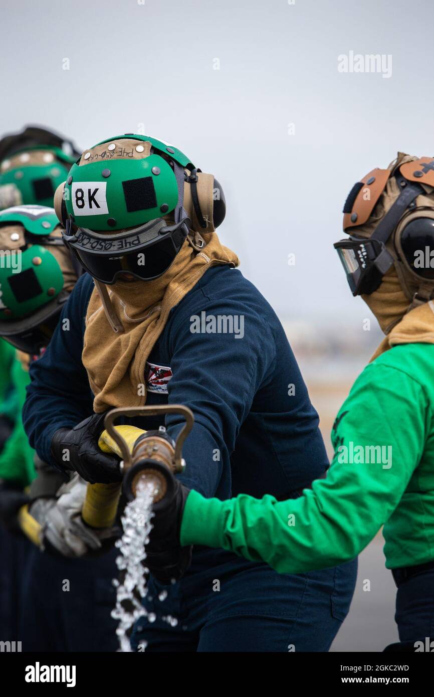 U.S. Navy Sailors with Fleet Logistics Support Squadron (VRC) 30, DET-5 ...