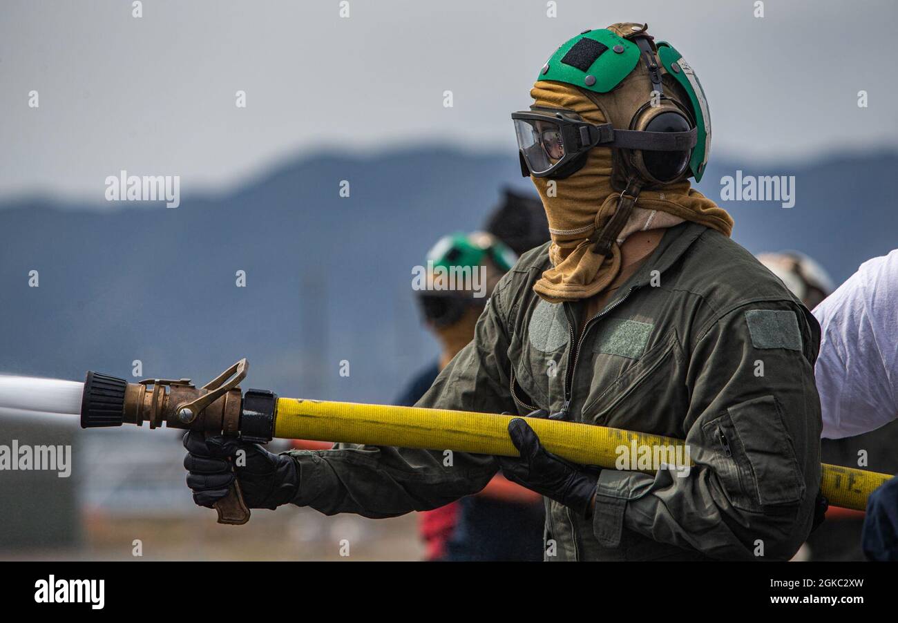 U.S. Navy Sailors with Fleet Logistics Support Squadron (VRC) 30, DET-5 ...