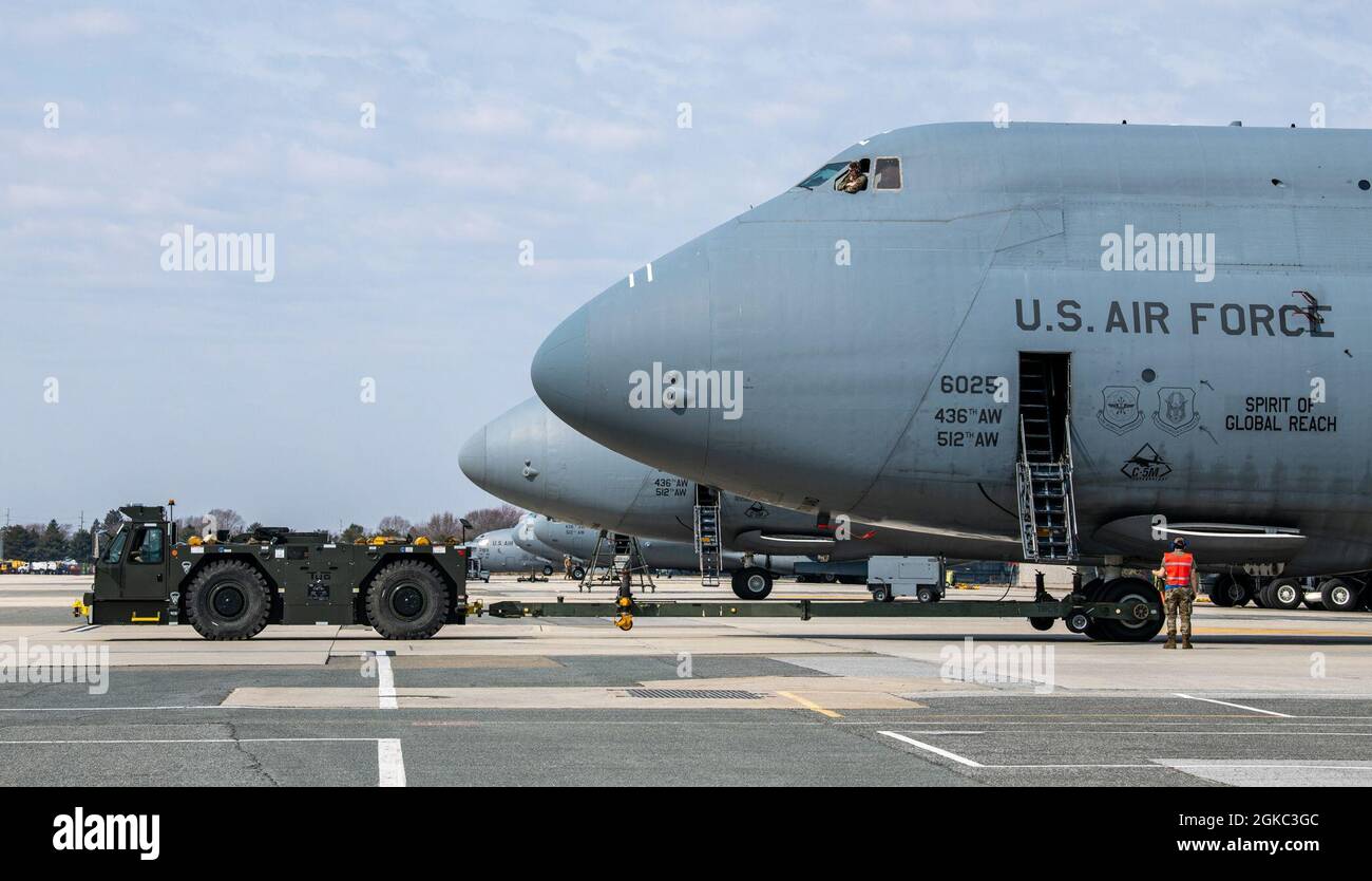 A maintenance tow team from the 436th Aircraft Maintenance Squadron ...