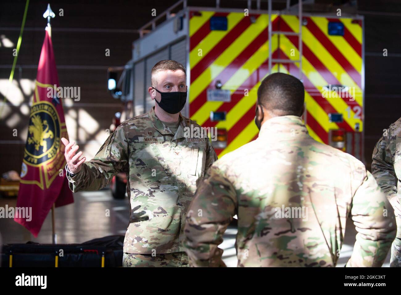 U.S. Air Force Col. Jason Schmidt, left, 501st Combat Support Wing vice ...