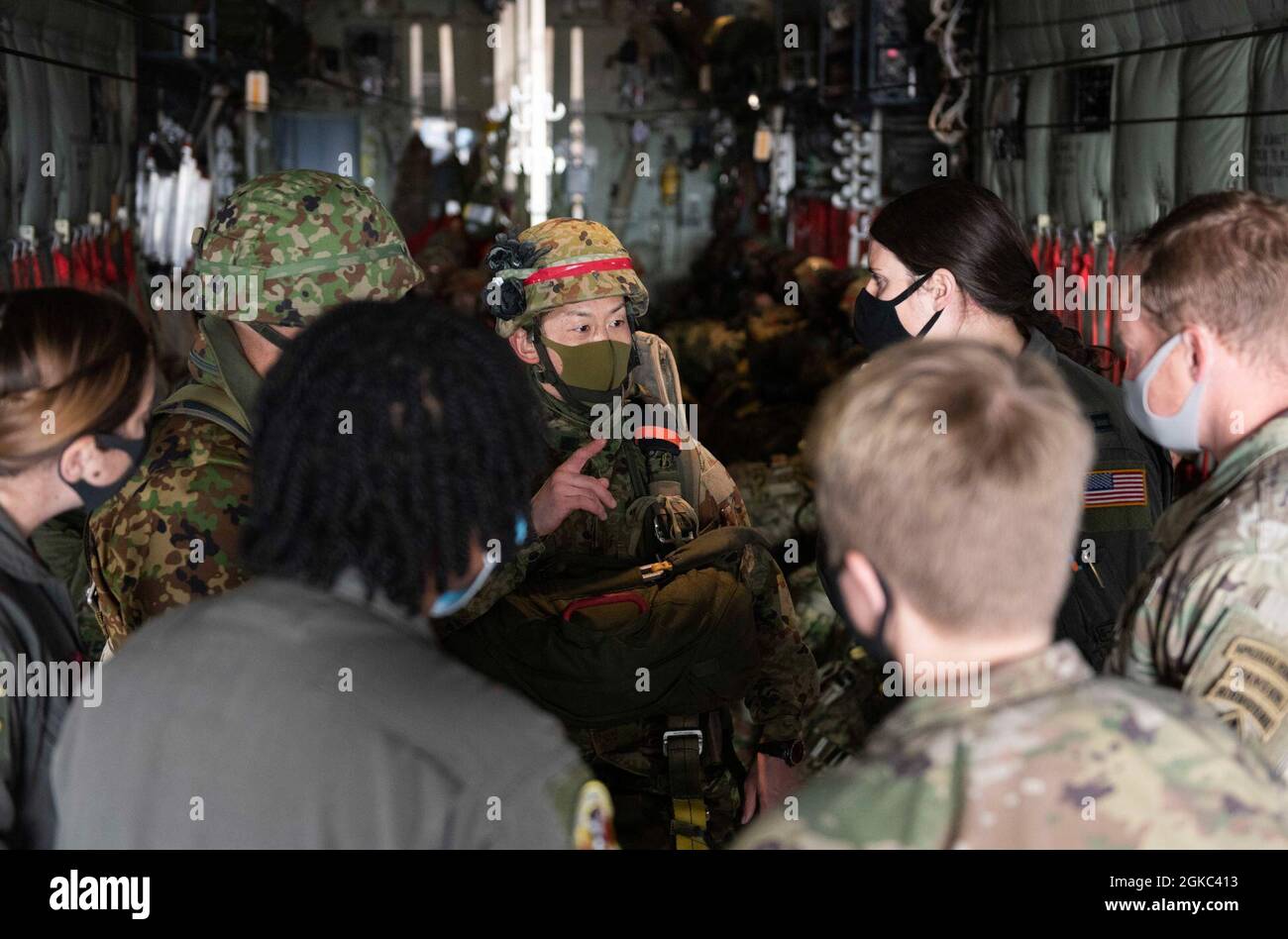 U.S. and Japan military personnel conduct a jump brief during an ...