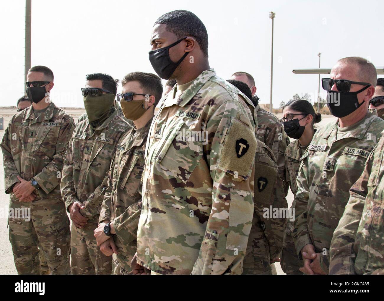 Soldiers from the 36th Inf. Div. listen to a speech from Brig. Gen ...