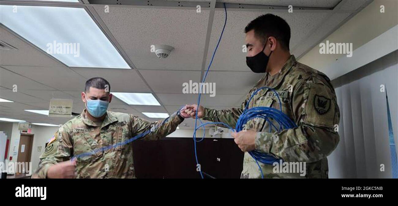 Sgt. Derik Gonzales(left) and Staff Sgt. Dane Kaneakua (right), run ...