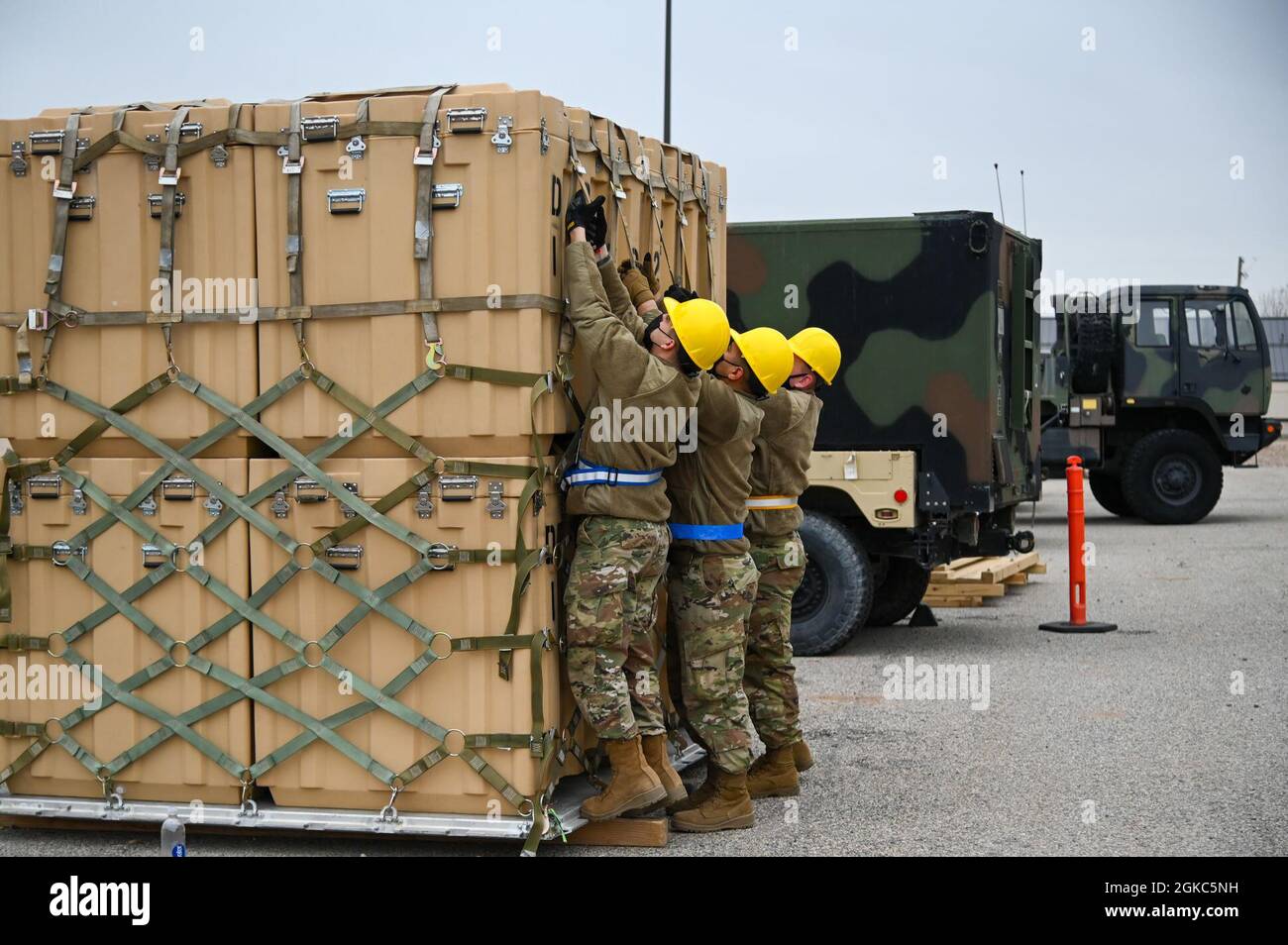 Airmen from 729th Air Control Squadron tighten straps on cargo March 9 ...