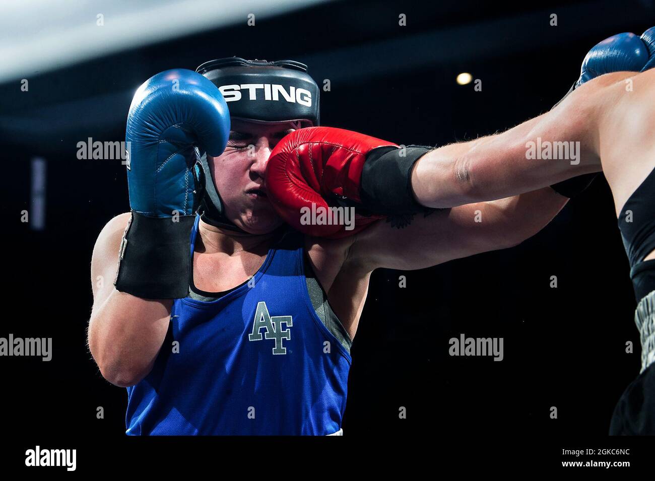 U.S. Air Force Academy -- Mack Lucas receives a punch from Annelise ...