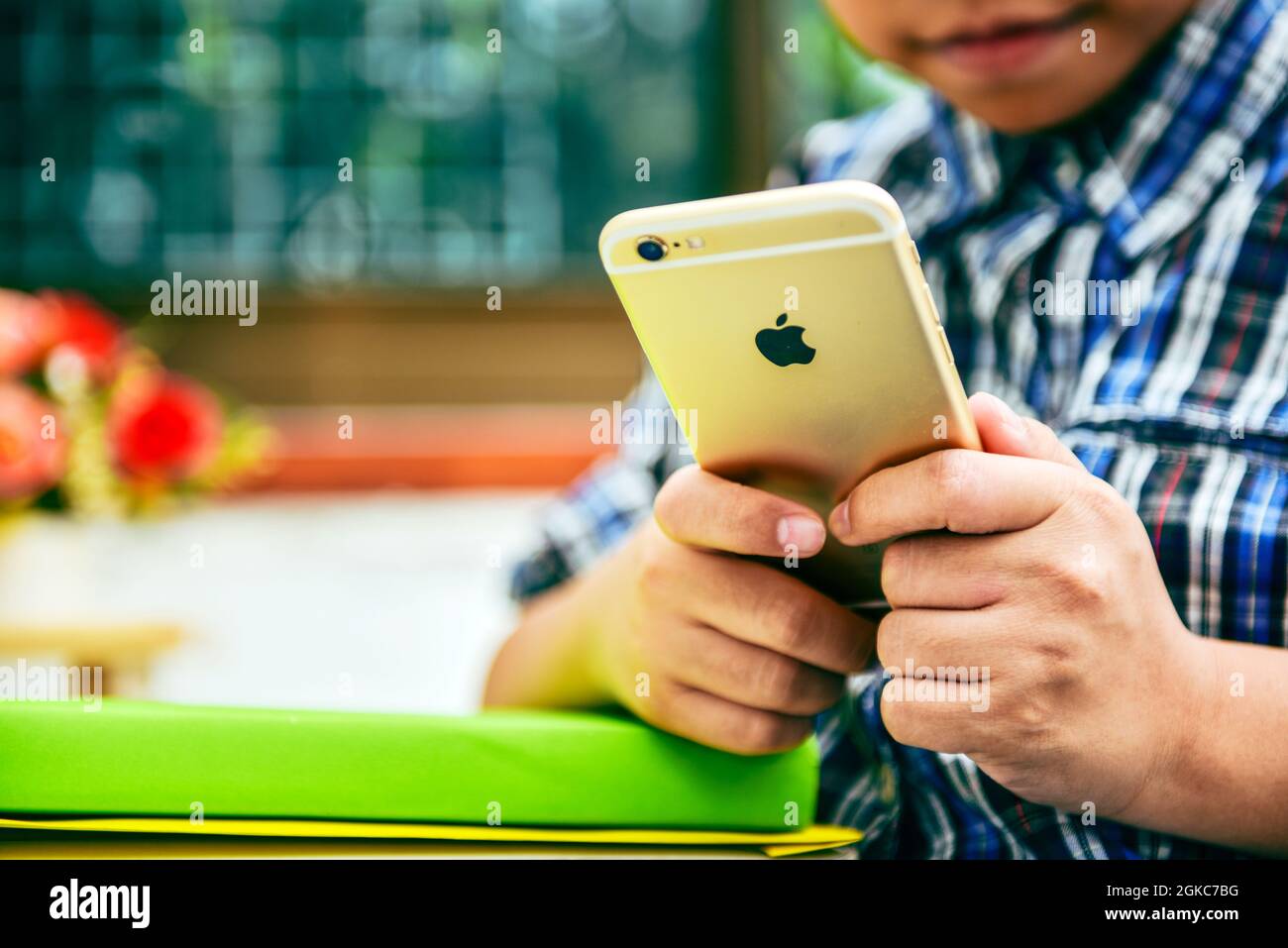 BURIRAM,THAILAND - MAY 13,2017: Unidentified young boy using Apple ...