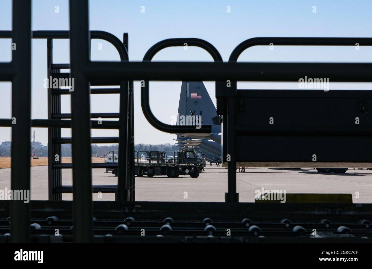 A K Loader drives across the flightline following the upload of Japan ...