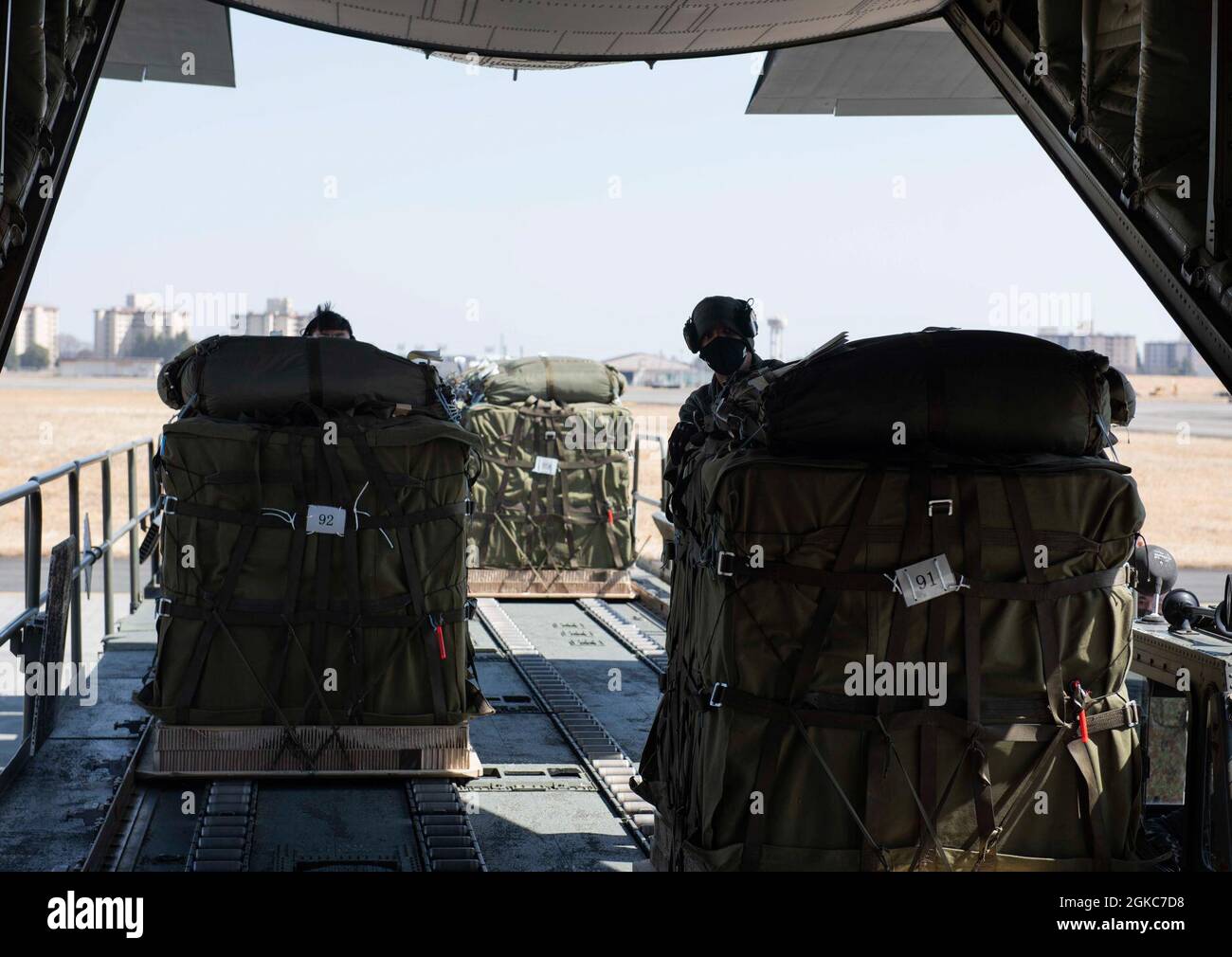 Loadmasters assigned to the 36th Airlift Squadron help guide ...