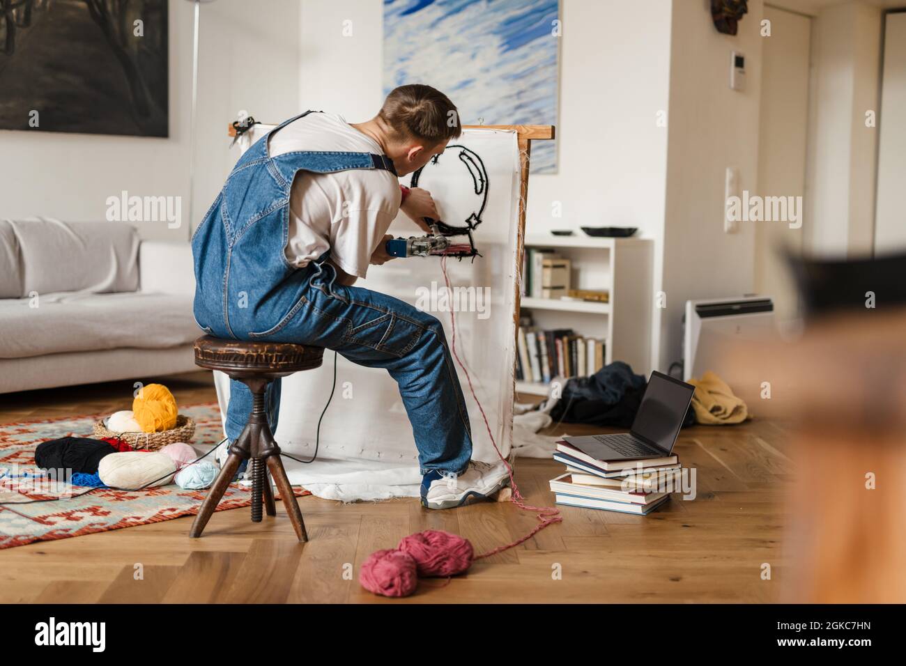 Man sewing home hi-res stock photography and images - Alamy