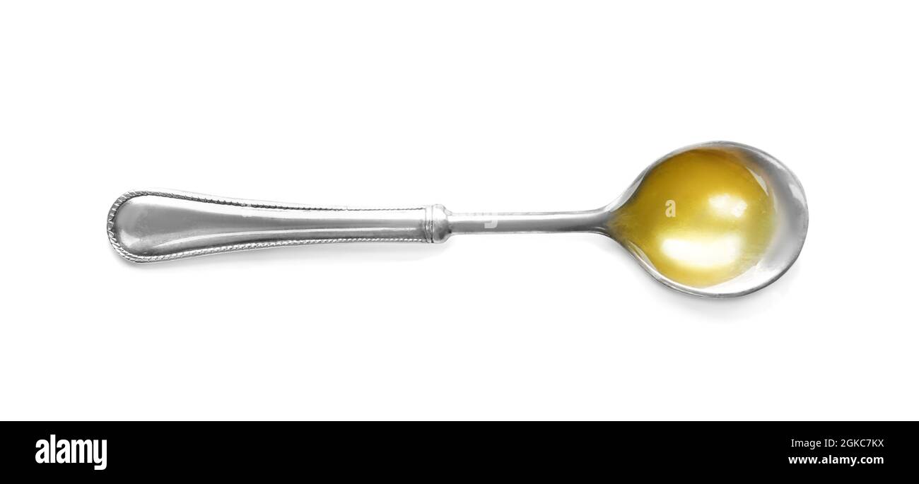 Spoon with cooking oil on white background Stock Photo - Alamy