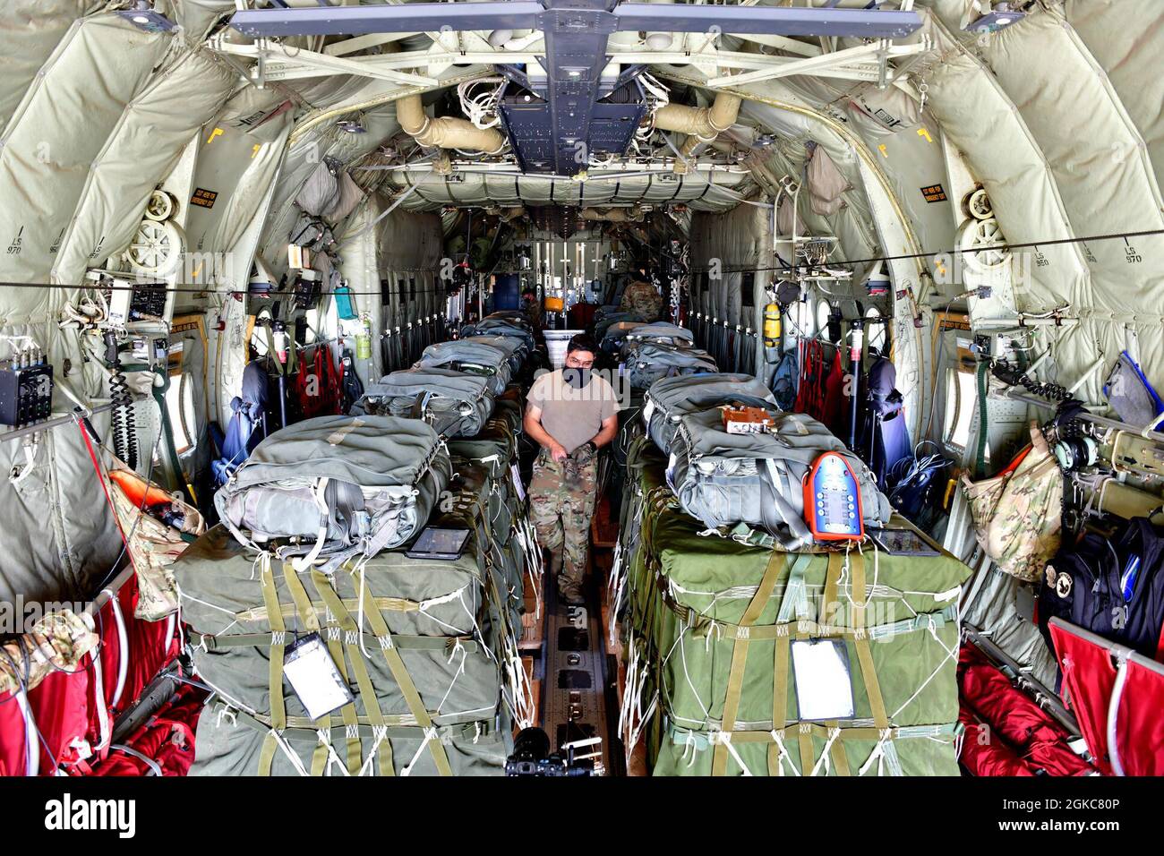 Tech. Sgt. Ralph Oliver, 40th Airlift Squadron loadmaster, checks the ...
