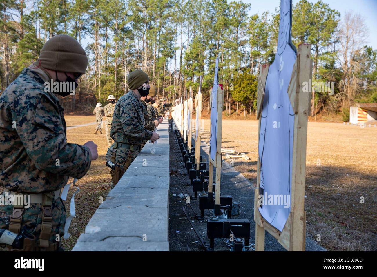U.S. Marines observe their shot groups after firing during the 2021 ...