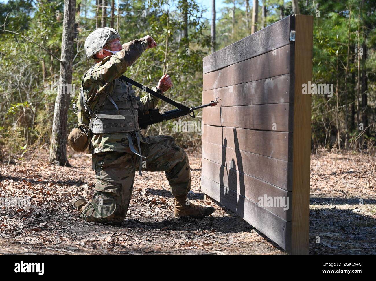 A U.S. Army Soldier throws a simulated hand grenade at a target during ...