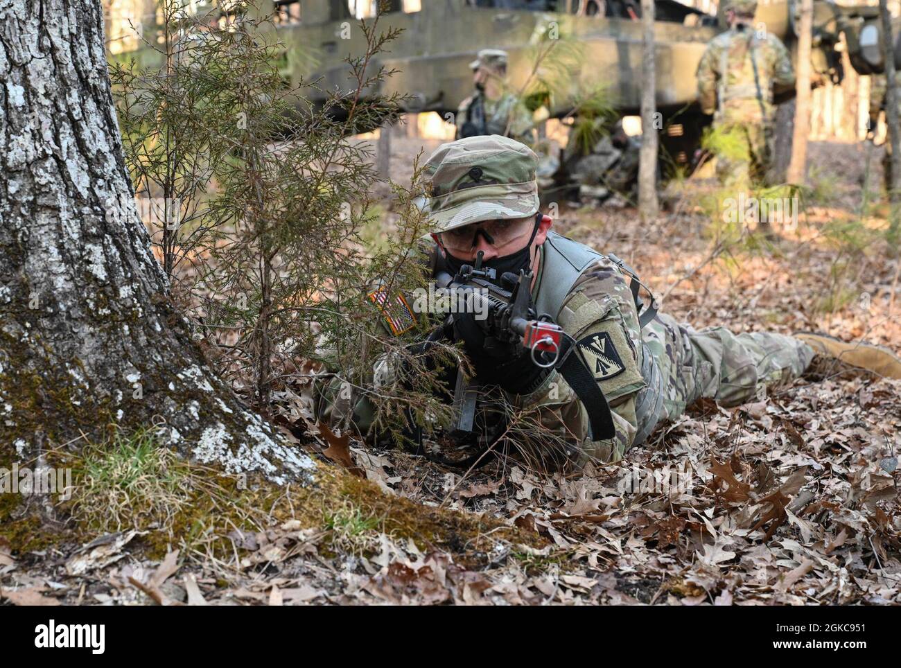 A U.S. Army Soldier scans his sector of fire while his battle buddies ...