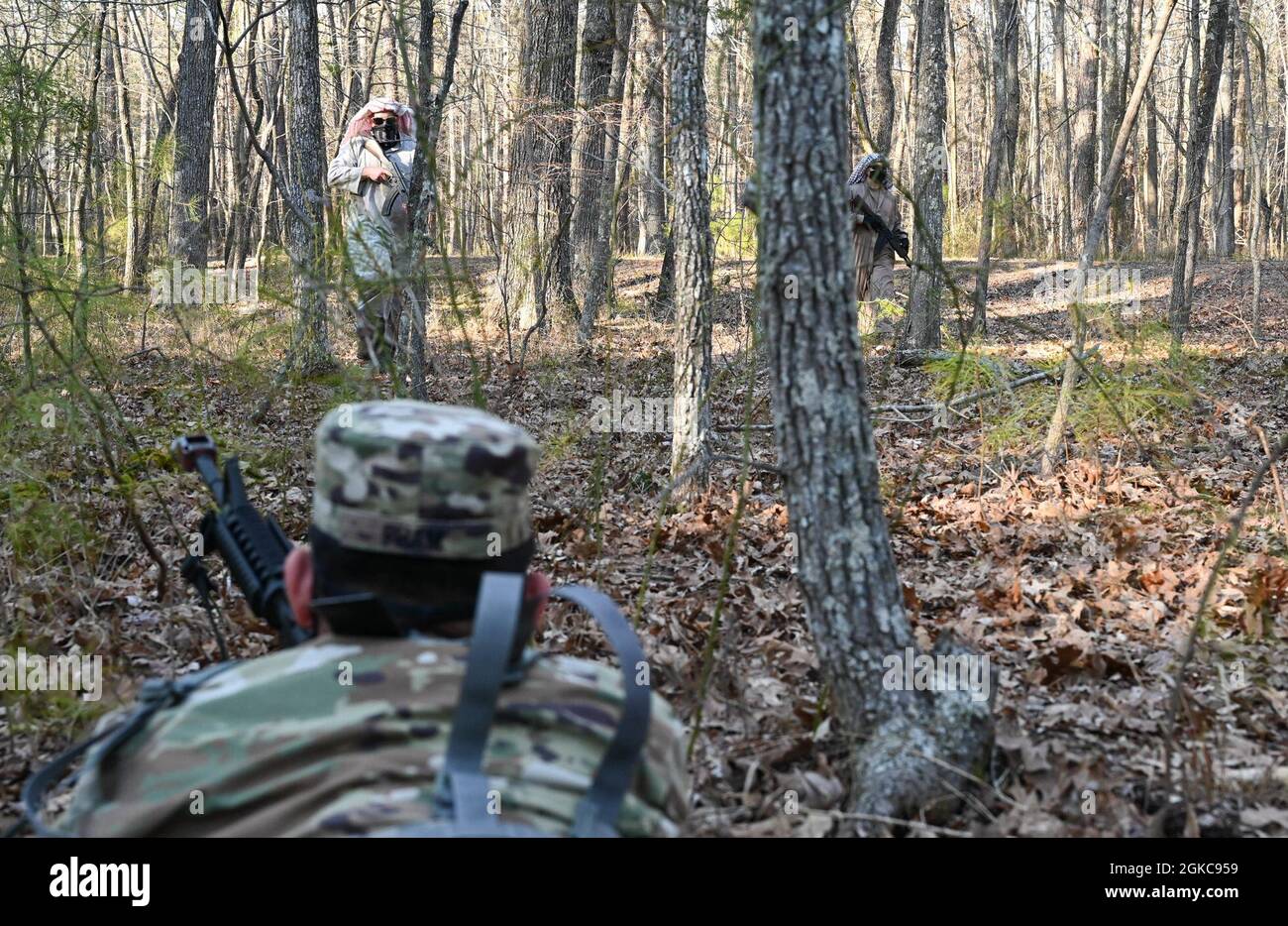 A U.S. Army Soldier scans his sector of fire while his battle buddies ...