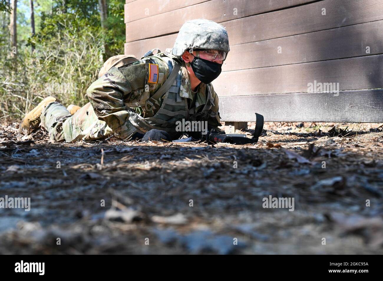 A U.S. Army Soldier prepares to throw a simulated hand grenade during a ...