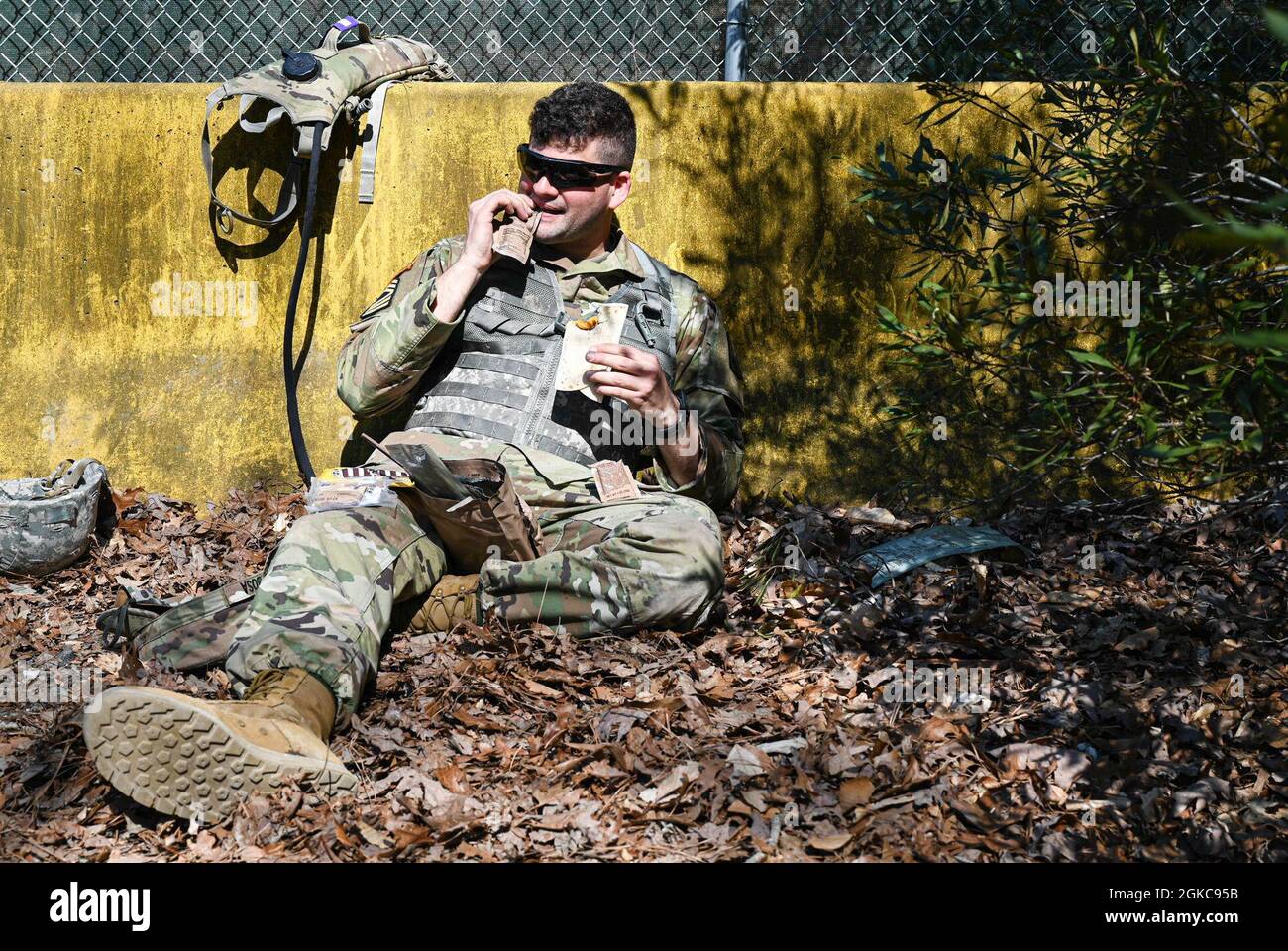 A U.S. Army Soldier opens part of his MRE (Meal Ready to Eat) during a ...