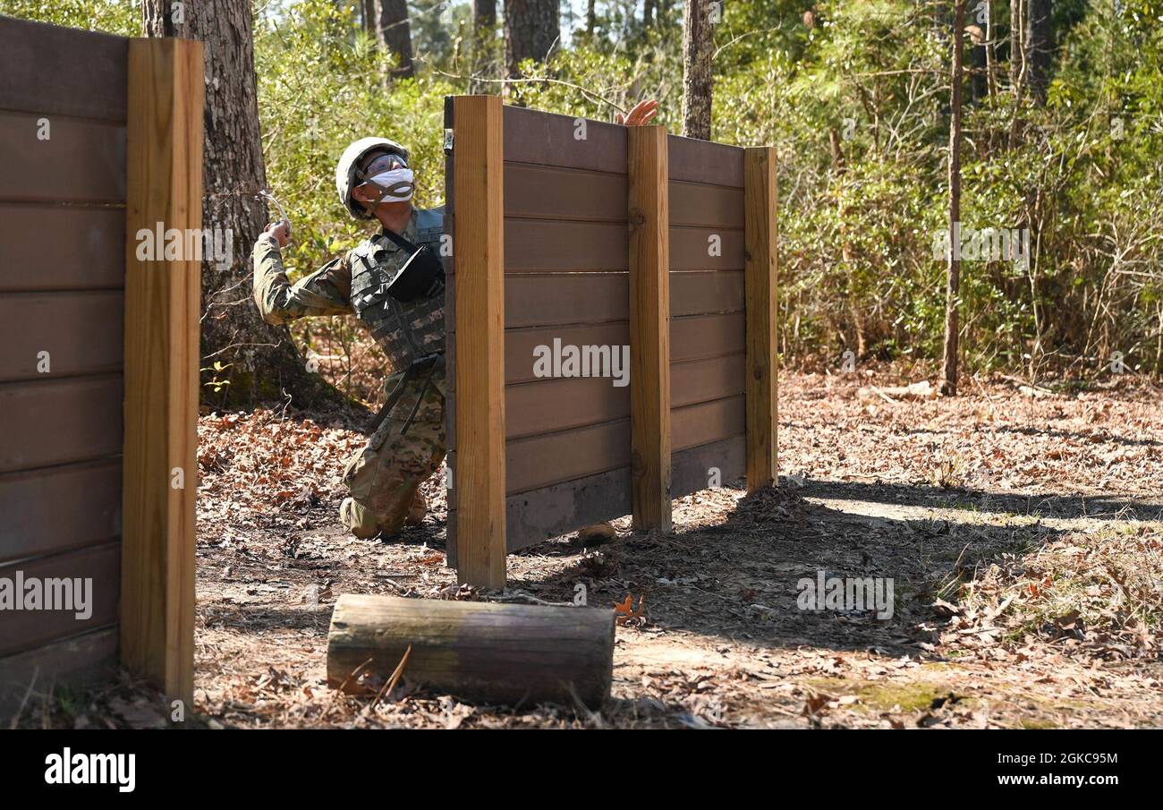A U.S. Army Soldier throws a simulated hand grenade at a target during ...