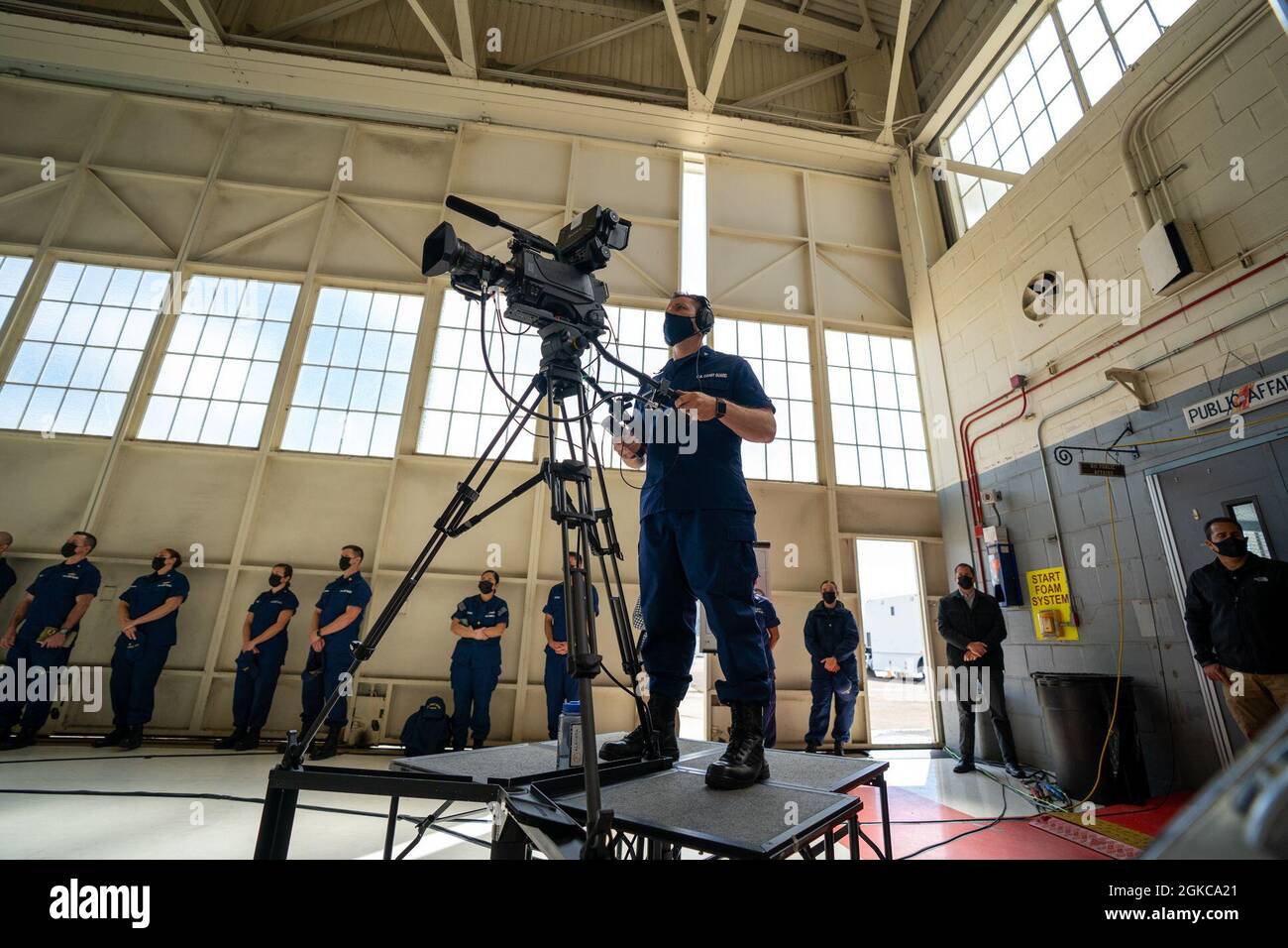 Chief Petty Officer Matt Masaschi operates a camera during the 2021 ...