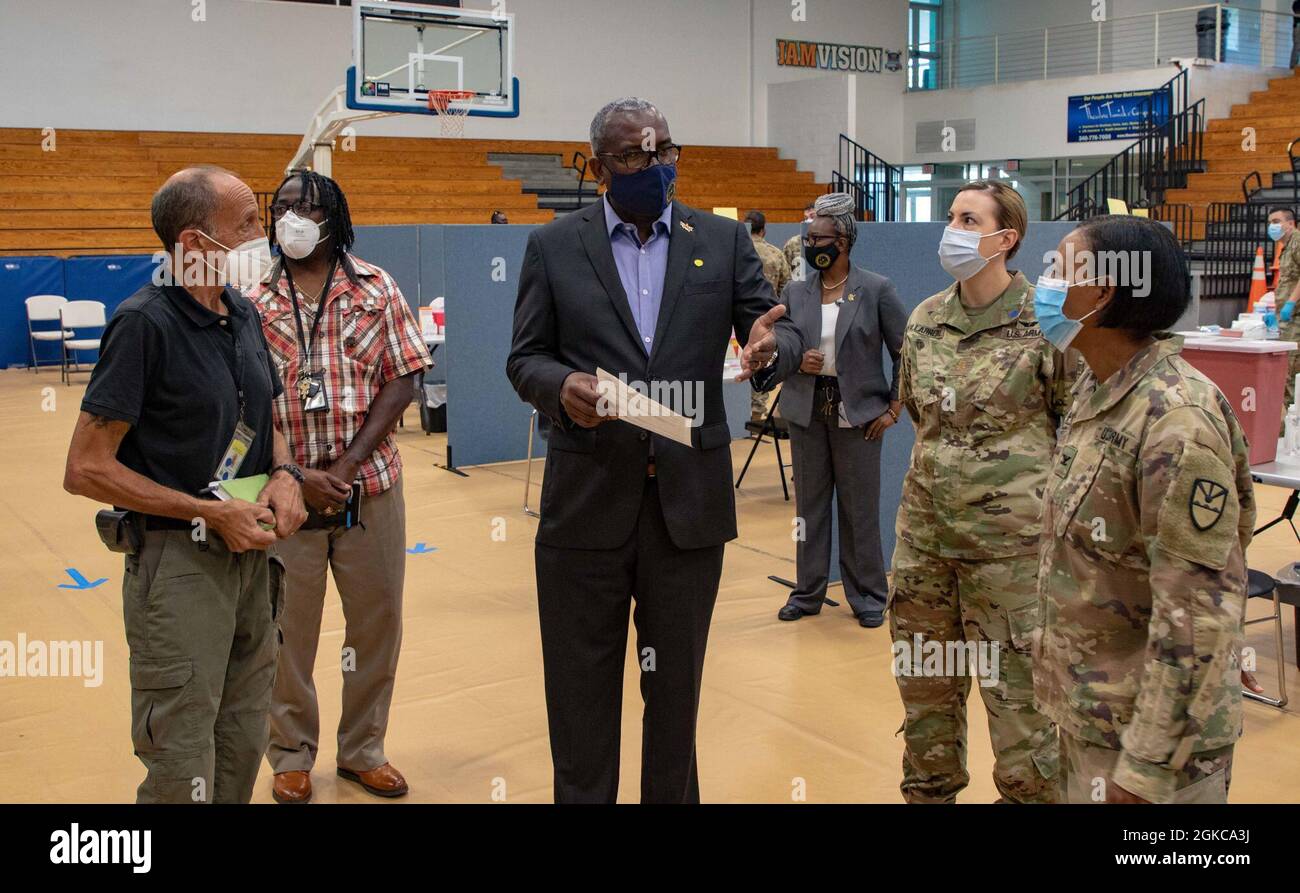 U.S. Virgin Islands Governor Albert Bryan Jr., (center) speaks with ...