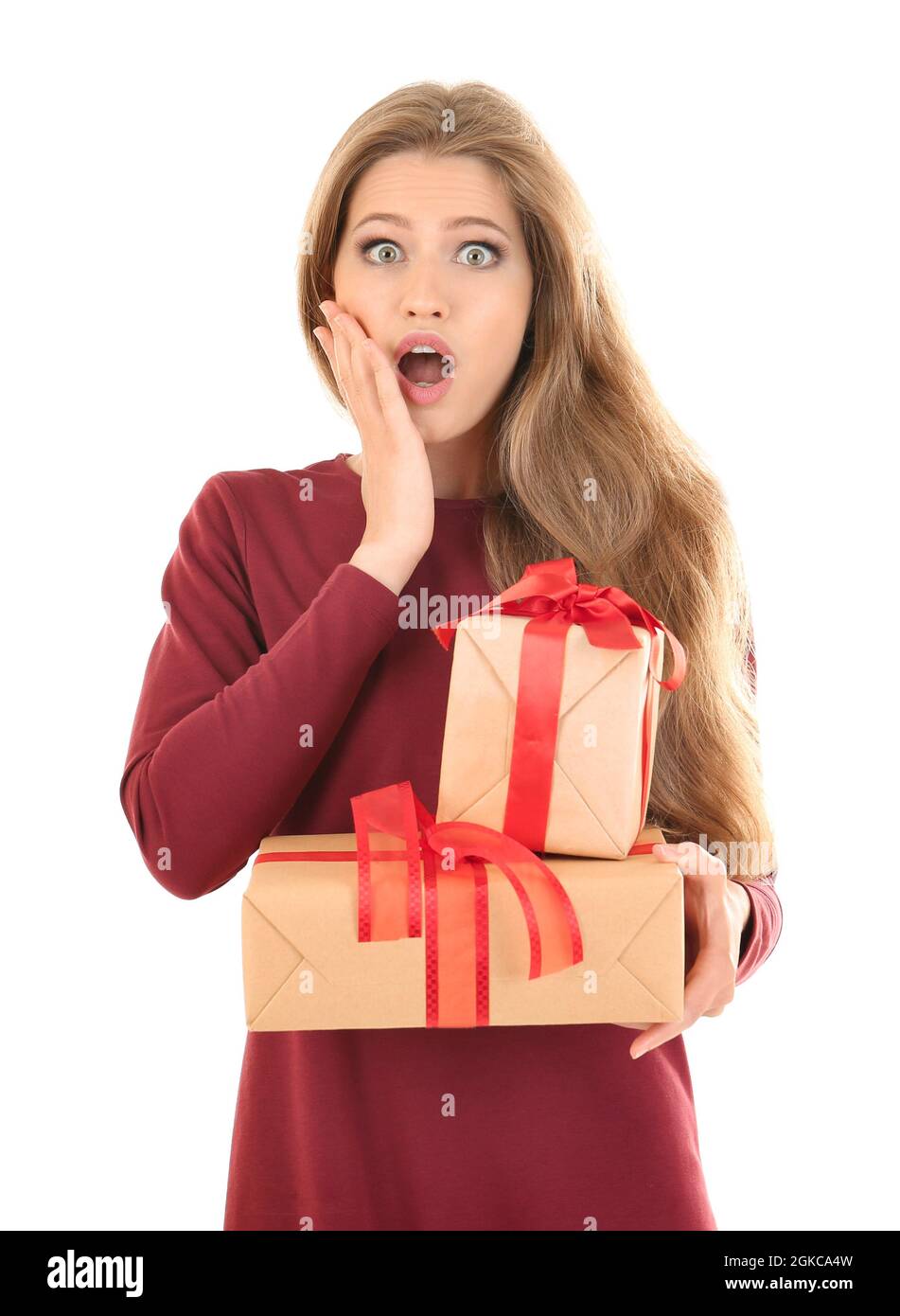 Excited lady holding gift boxes against white background Stock Photo ...