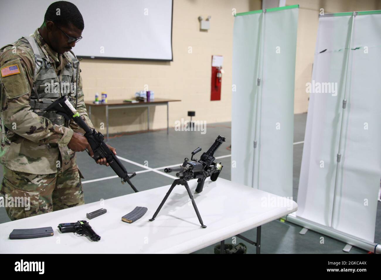 Sgt. Reginald Ritter conducts a functions check on an M-4 at the Lt ...
