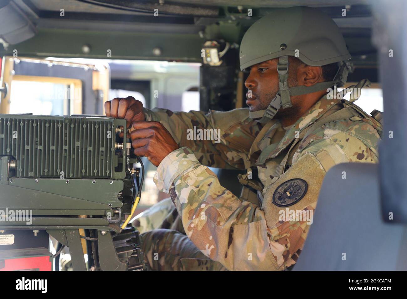 Pfc. Eddison Lewis, HHC 786th puts a Single Channel Ground and Airborne ...
