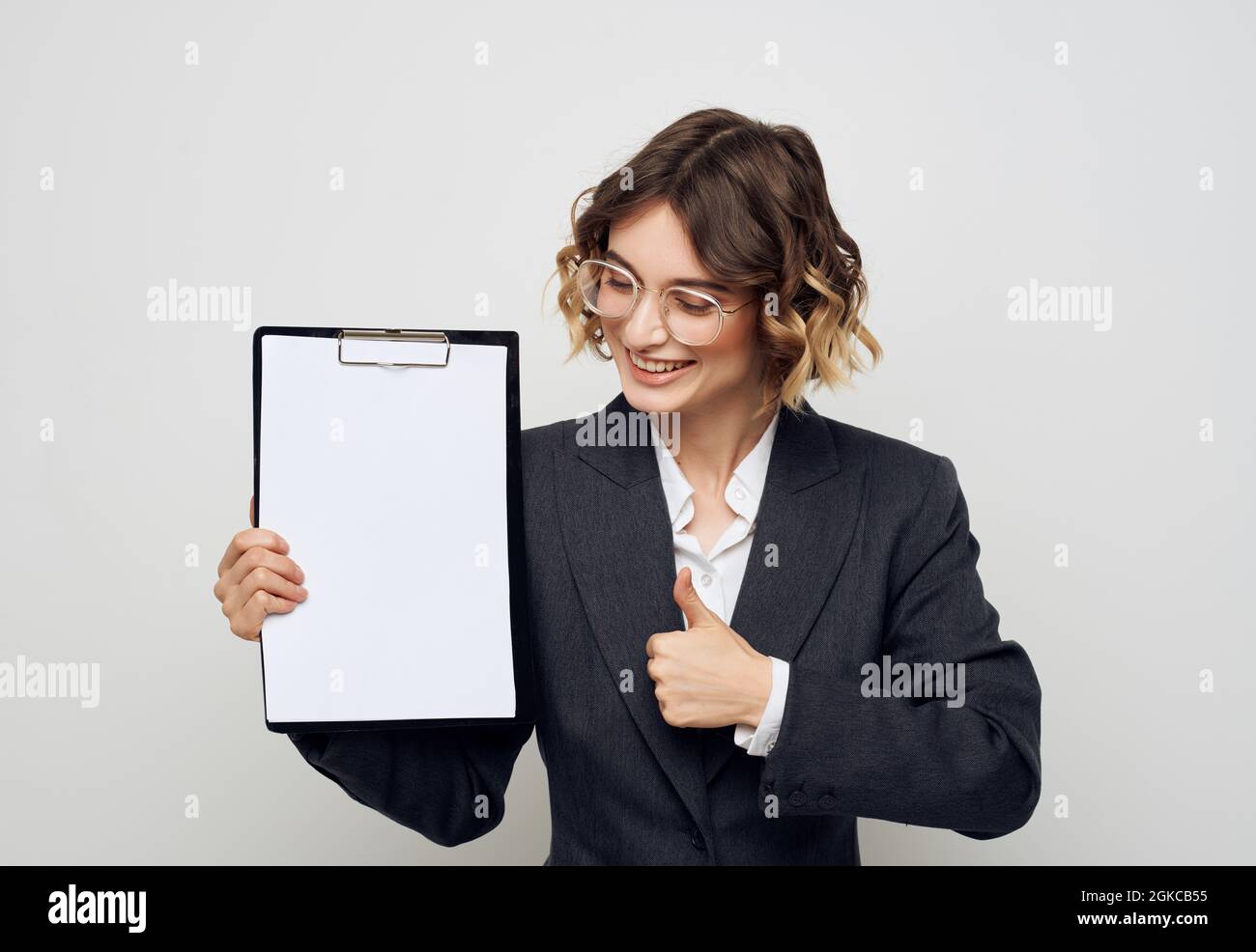 Business woman in suit with folder for documents Copy Space Studio ...