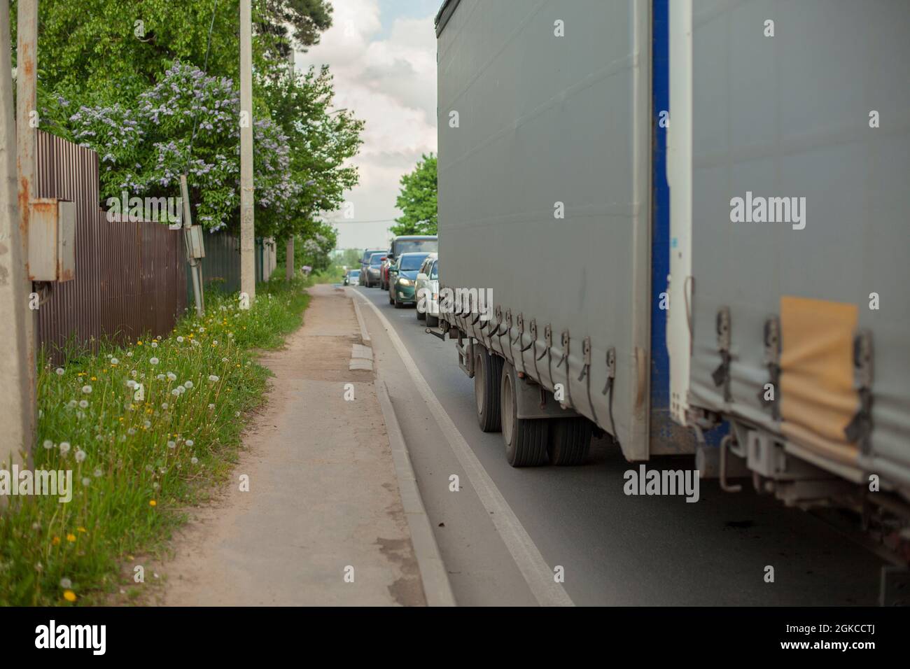 Traffic jam. Freight transport is stuck in a traffic jam on a narrow ...