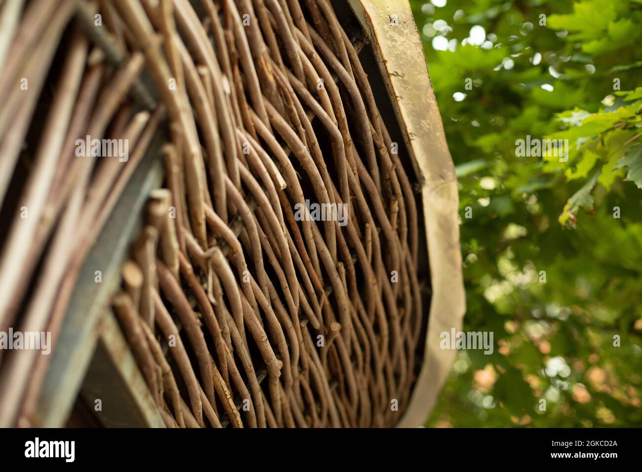 Braided plant twigs. Details of the veranda. Background summer building ...