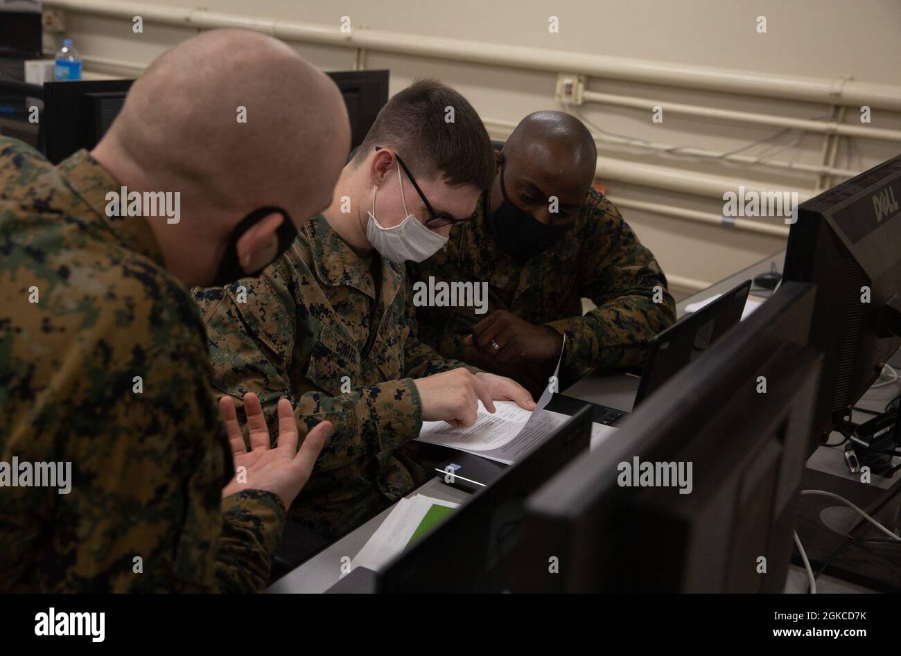 U.S. Marines with 7th Communication Battalion work to identify ...
